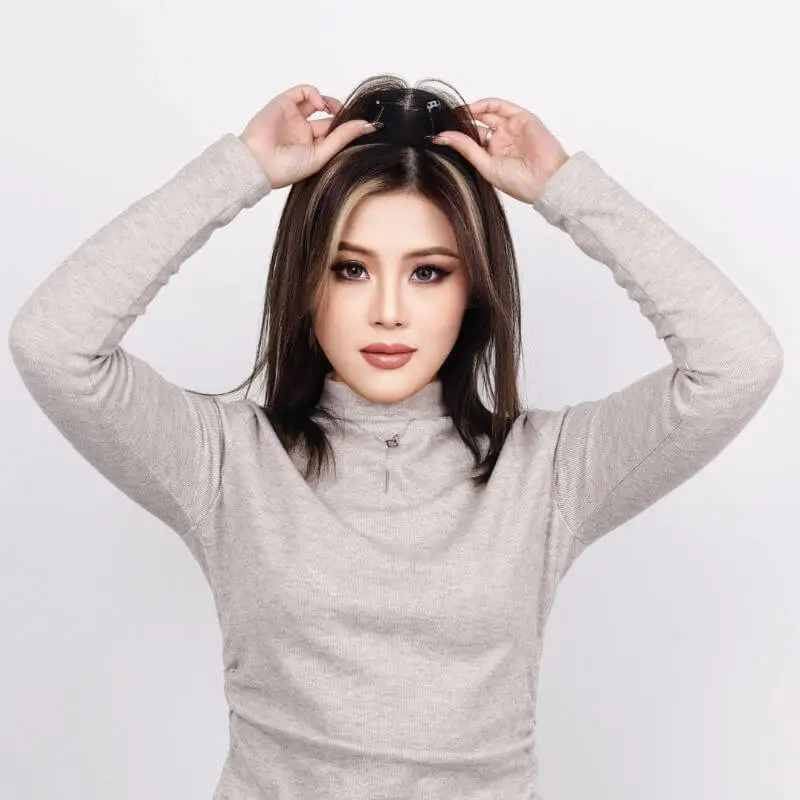 Gently open all the clips on the underside of the mini topper. Align the lace base with your ...